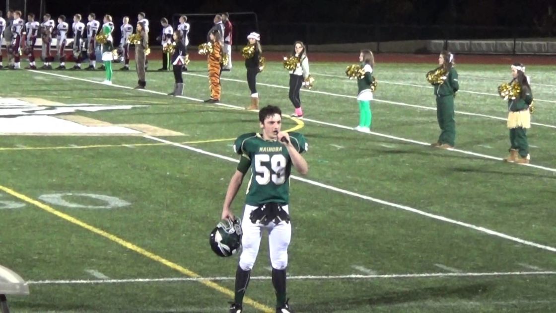 Unexpected singer astonished the crowd in a High School football game.