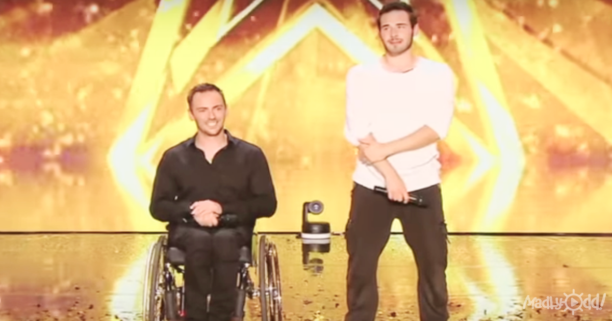 A man in a wheelchair looks up at his partner before starting a ...