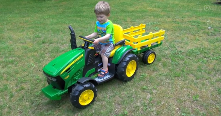 Little boy loves John Deere tractors