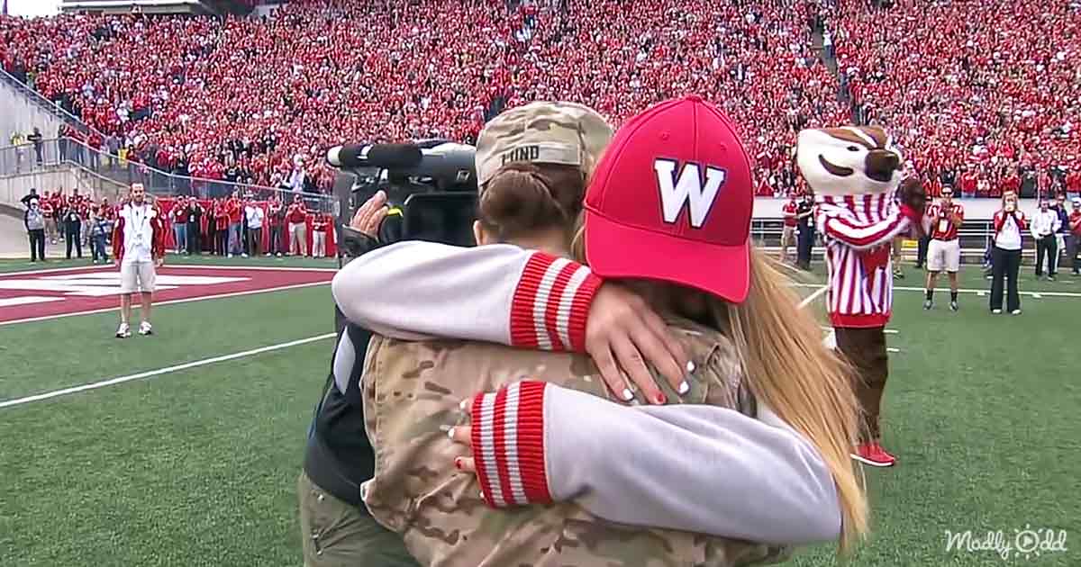 Soldier mom returns to surprise daughter at a Wisconsin football game