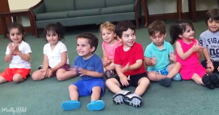 Giggling toddler cracks up class while singing “Clap Your Hands ...
