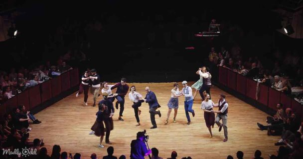 Swing dancing duo sizzles, twirling into hearts with electrifying moves ...