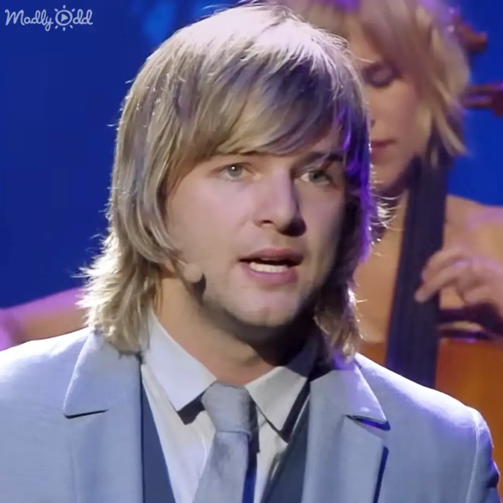 Keith Harkin sits on stage and sings “All Out of Love", creating a rare ...